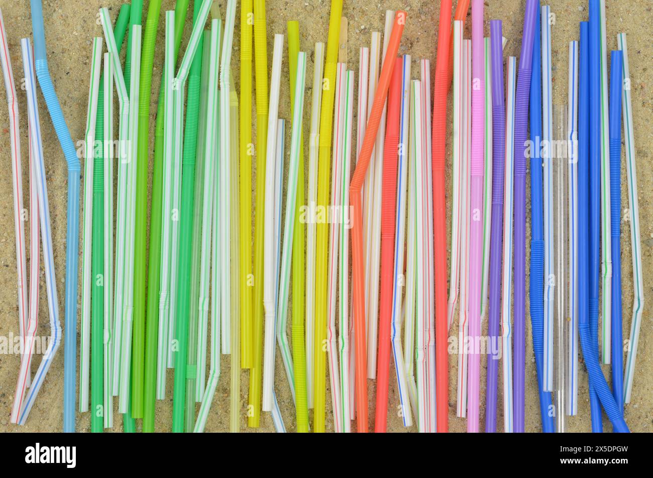 Ecological education - a large group of straws on a beach after summer ...