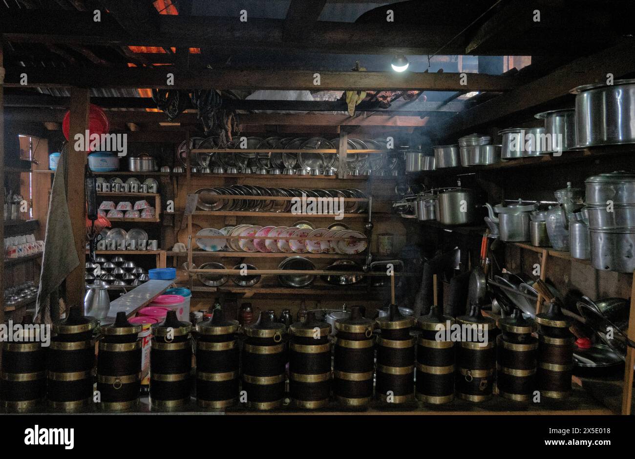 Traditional teahouse kitchen with tongba millet alcohol vessels on the ...