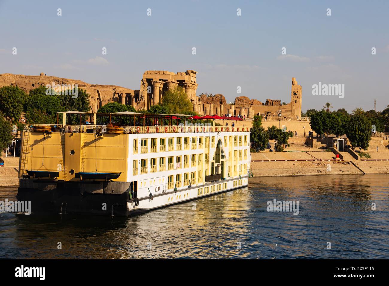 Nile cruise ship approaching the landing dock at The Ptolemaic temple ...