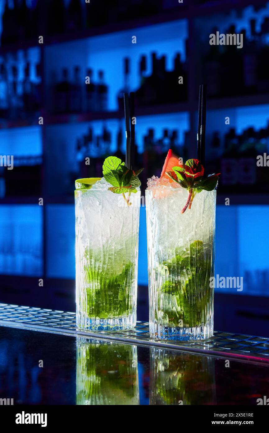 Mojito cocktails based on rum, mint and lime on the bar counter of a ...