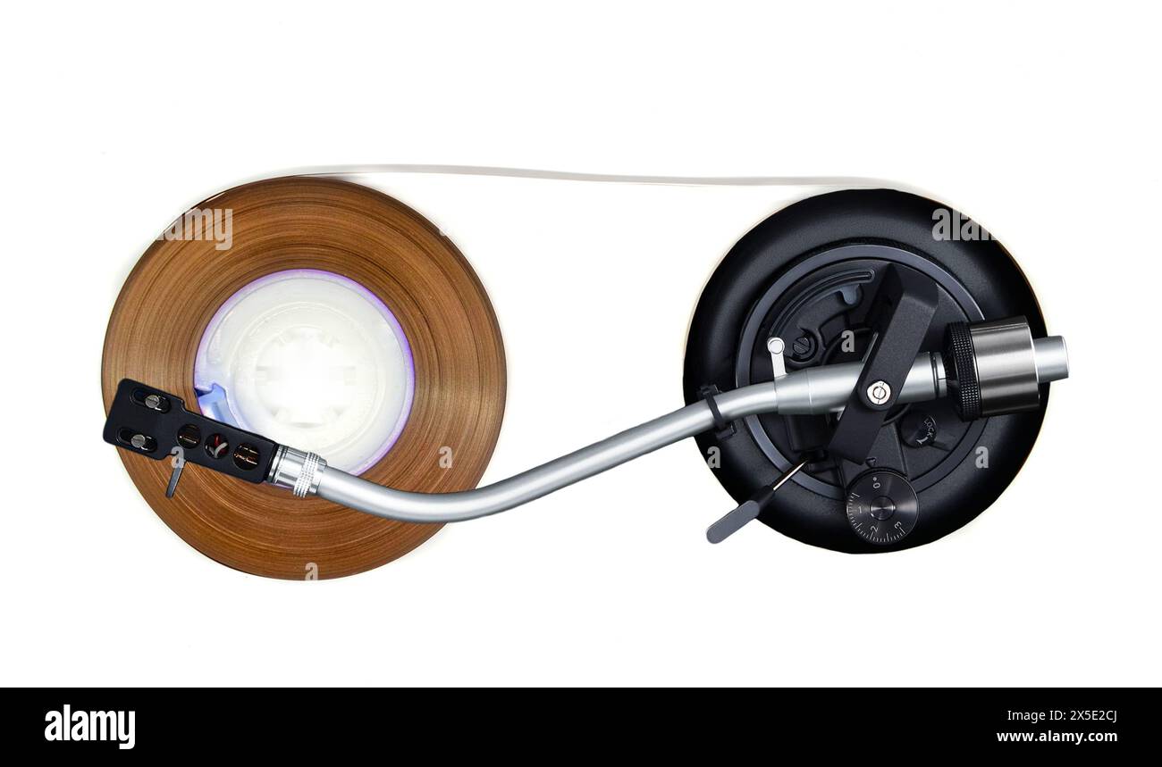 Turntable arm on old audio cassette tape rolls Stock Photo - Alamy