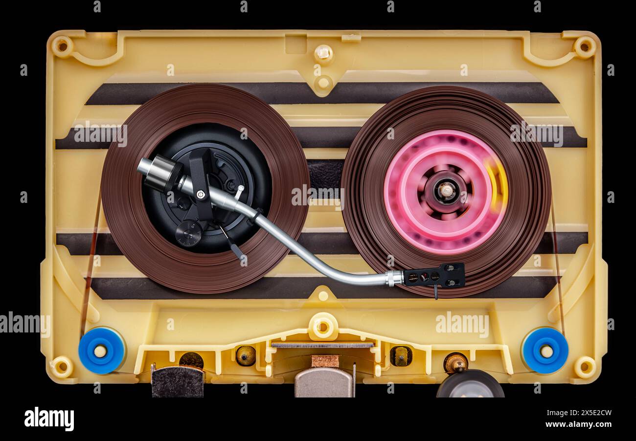 Turntable arm on Audio cassette tape in use sound recording in the tape ...
