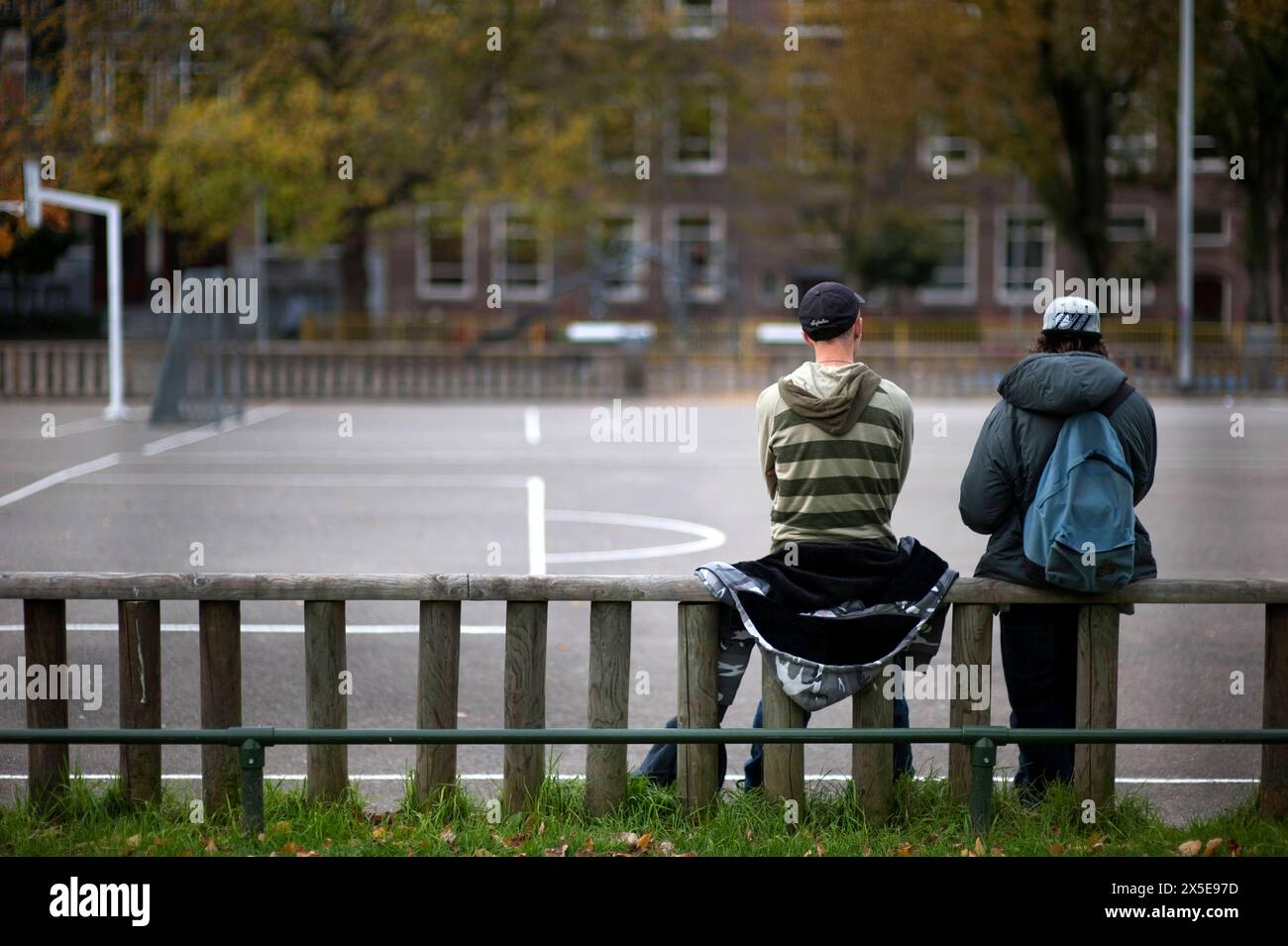 Two Young man on a Railing Two Young Adult Males having a Personal ...
