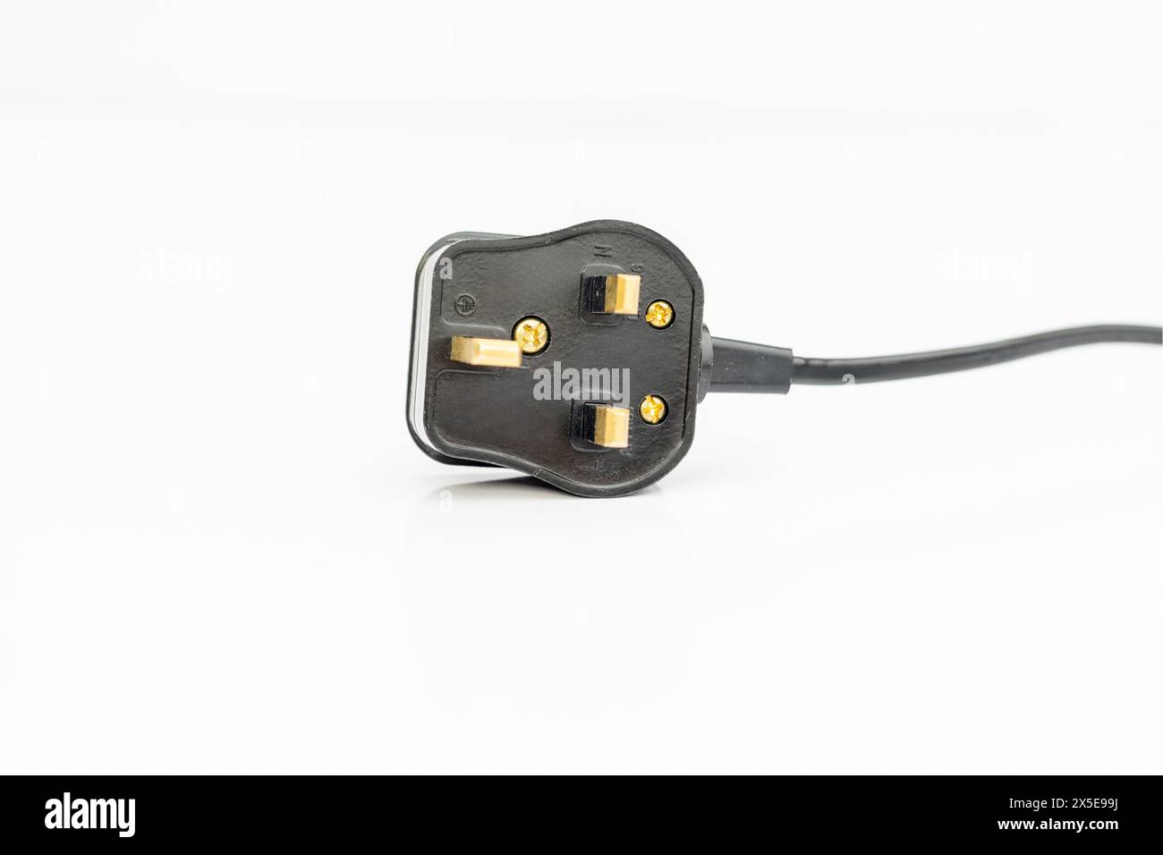 Three pin ac power plug isolated on white background Stock Photo - Alamy