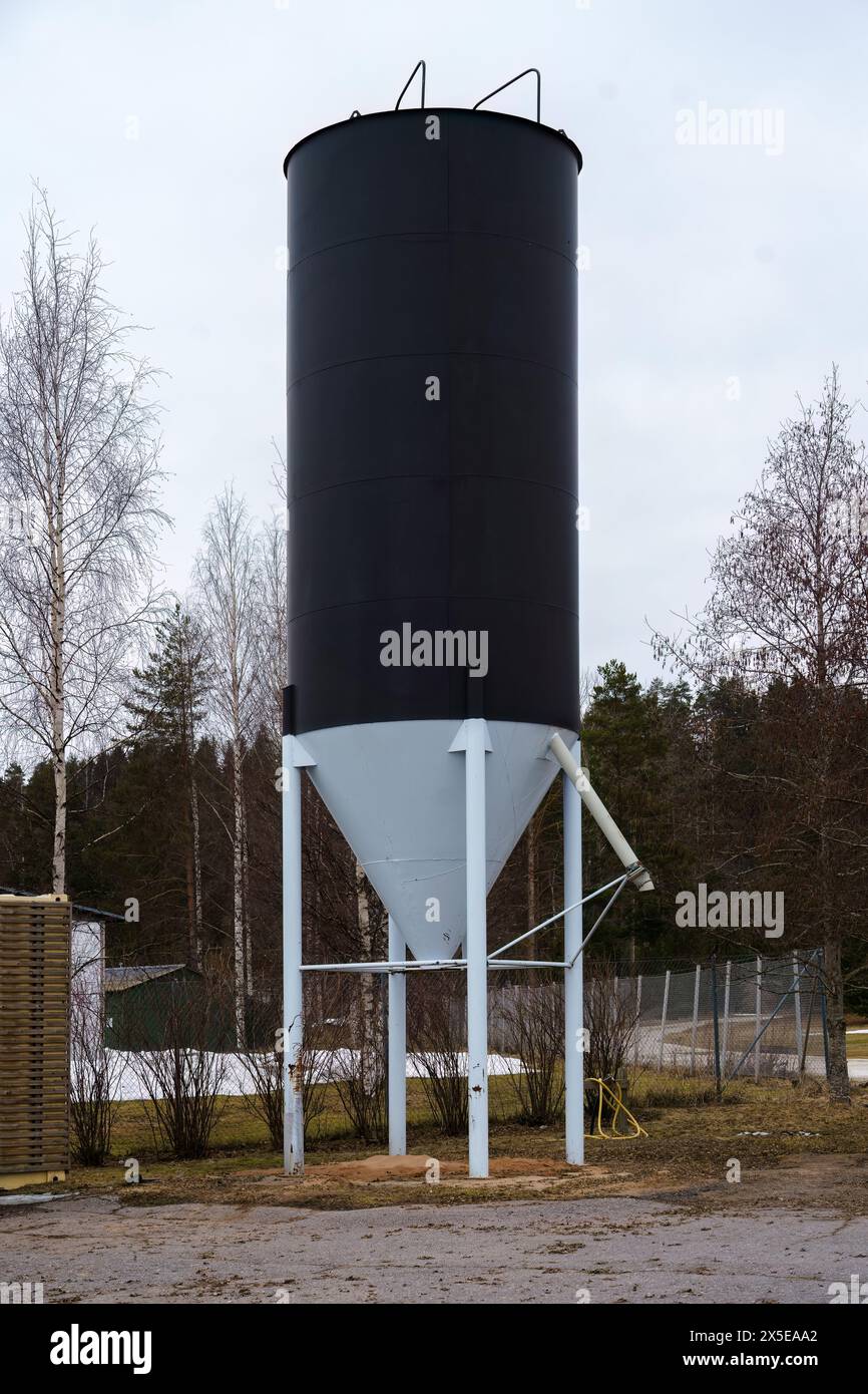 Small black metallic silo outdoors Stock Photo - Alamy