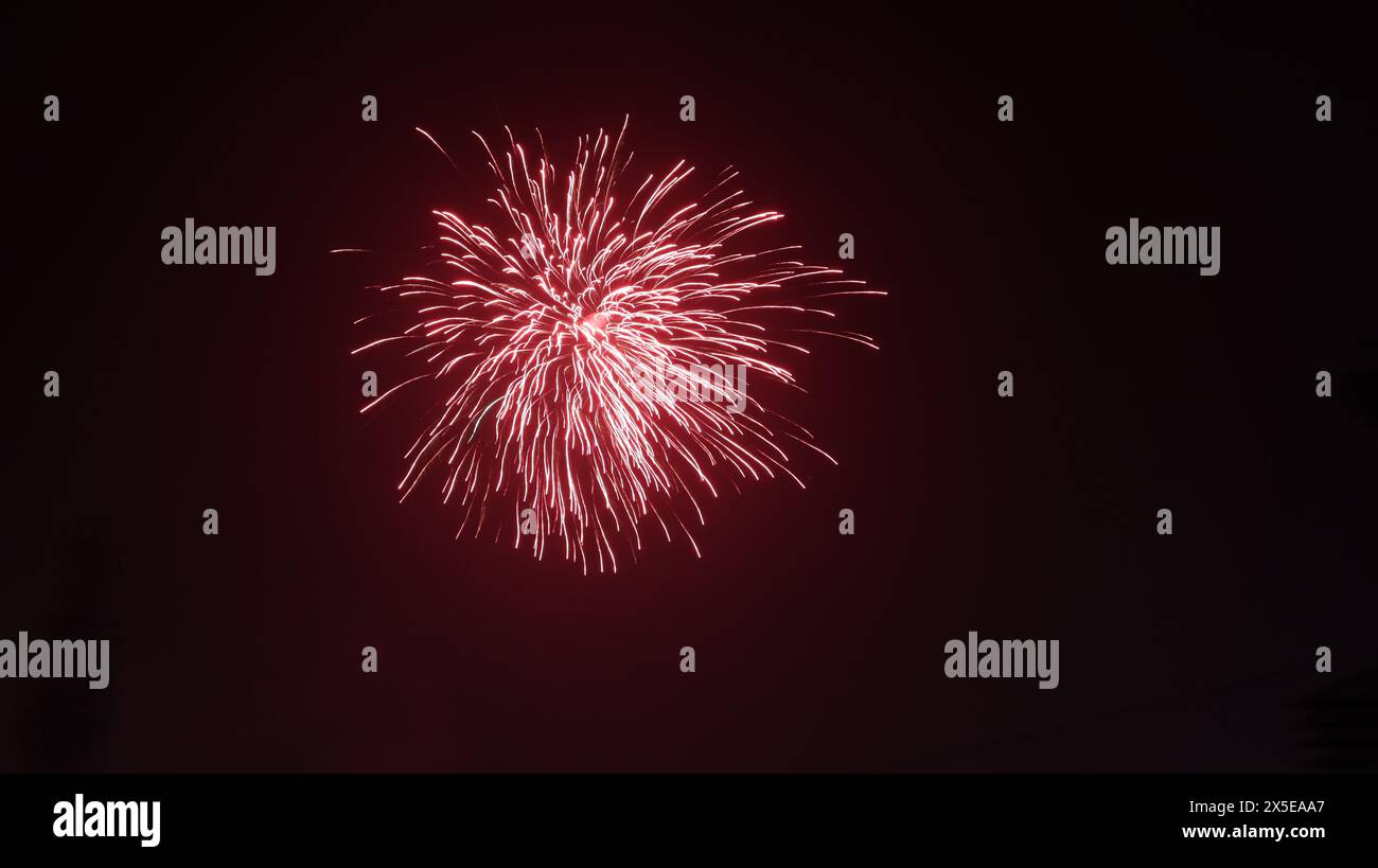 Red blast in Black sky Fire work Stock Photo - Alamy
