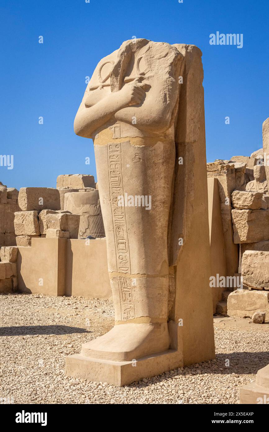 Headless statue of a Pharaoh holding an Ankh Cross in each hand. Karnak ...
