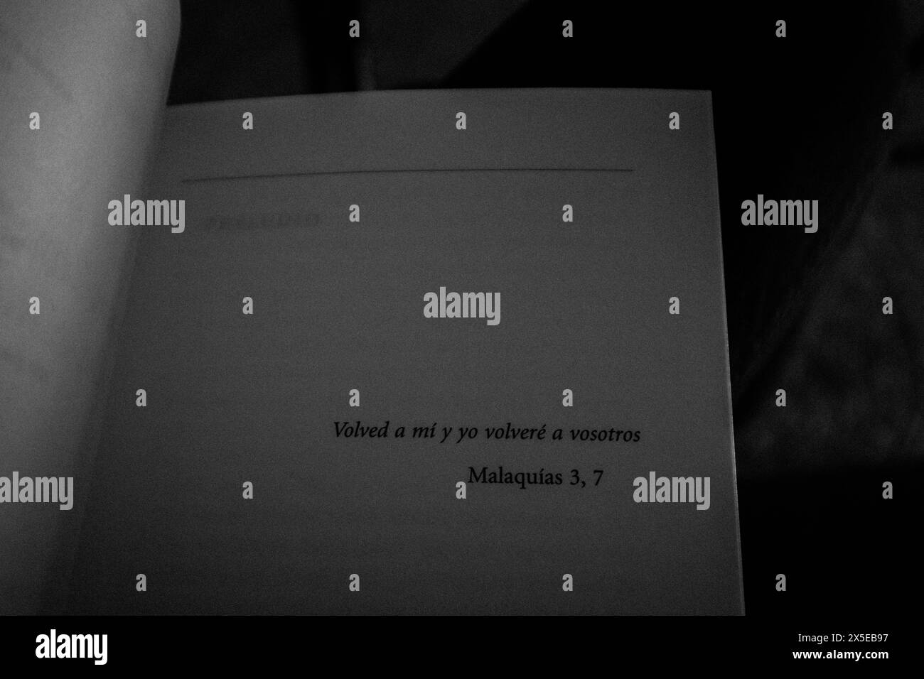 Madrid, Spain. May 1, 2024 Open paper book bible with quote text ...