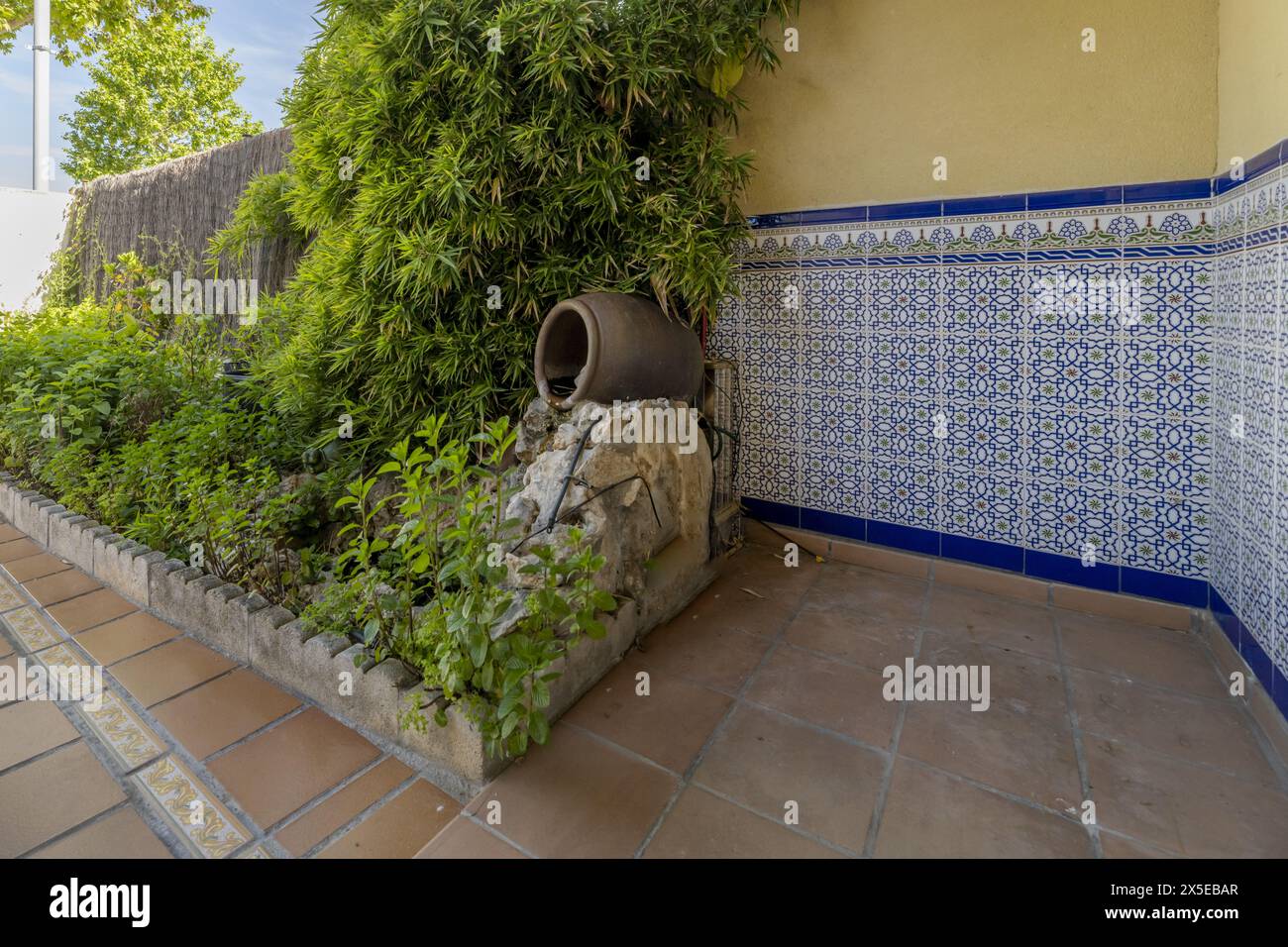 Entrance of a chalet with terracotta floors with Spanish style tiles on ...