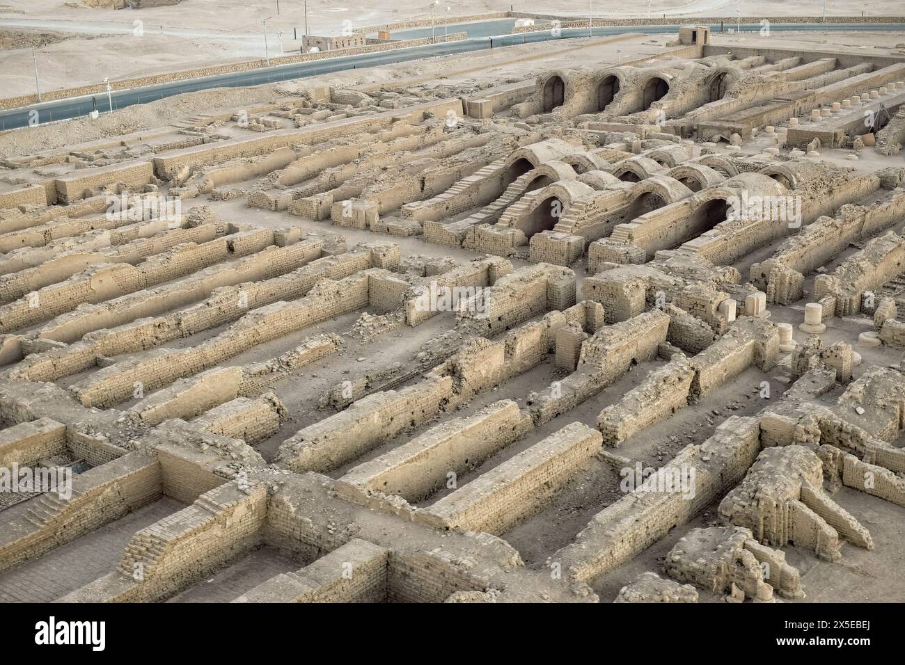 The vaults of the Ramesseum granaries spread across the desert sands at ...