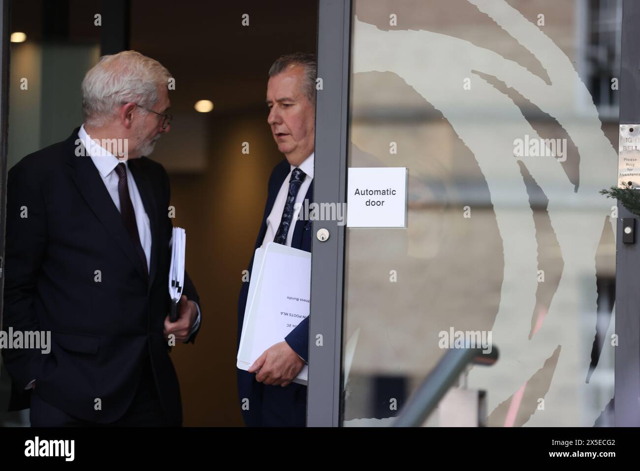 DUP MLA Edwin Poots (right) and solicitor John McBurney, leaving the ...