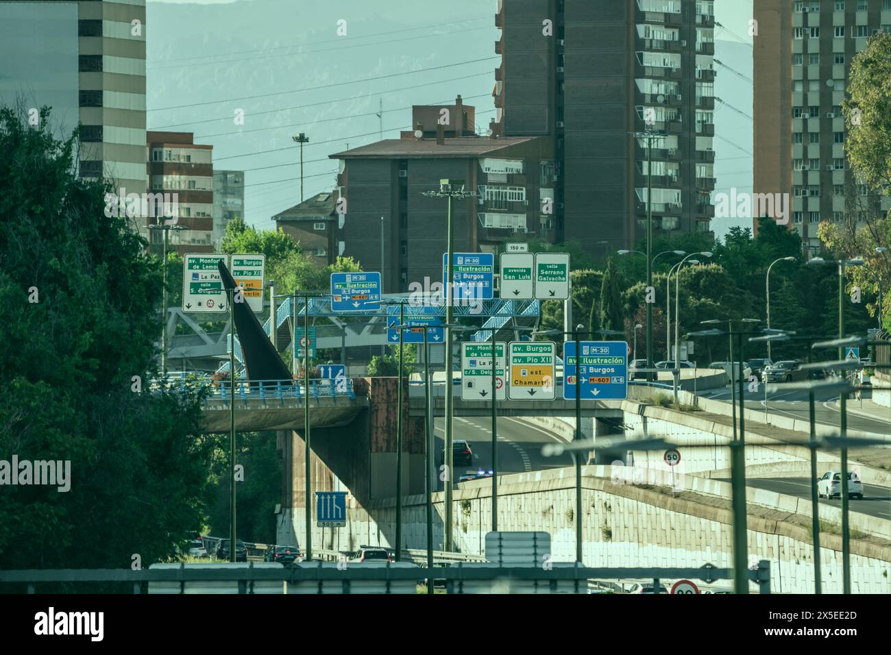Urban entrance road to Madrid with several lanes in each direction and ...