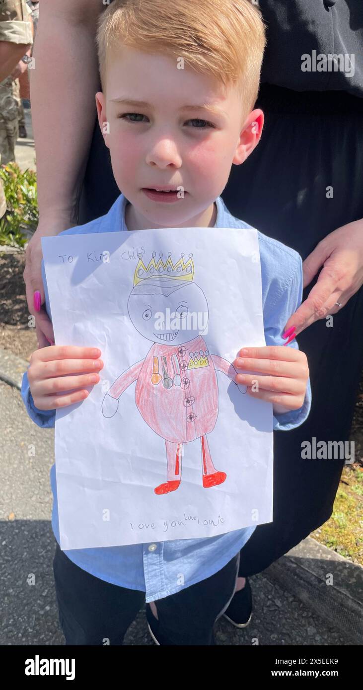 Louie Bacon, six, with his drawing of King Charles III that he ...