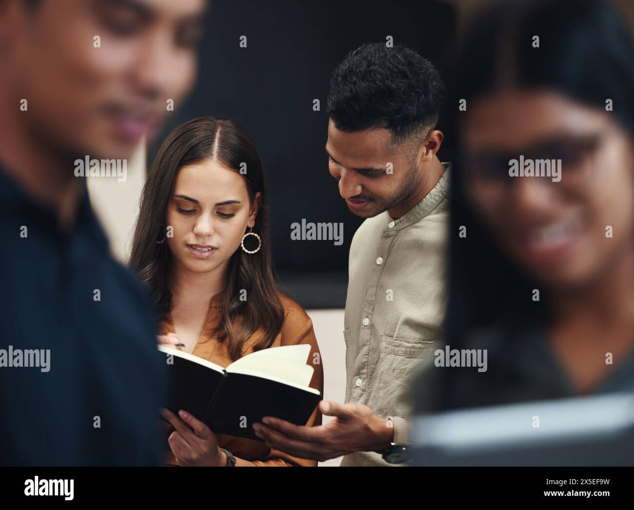 Business people, mentor and intern with notes for questions, training ...