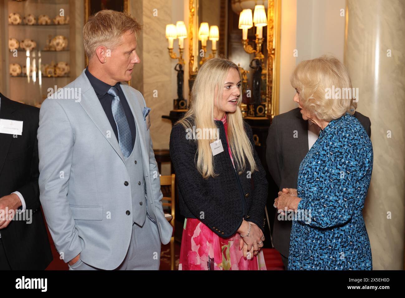 Queen Camilla speaks to Esme Higgs and ventaniarian Dr Scott Miller as ...