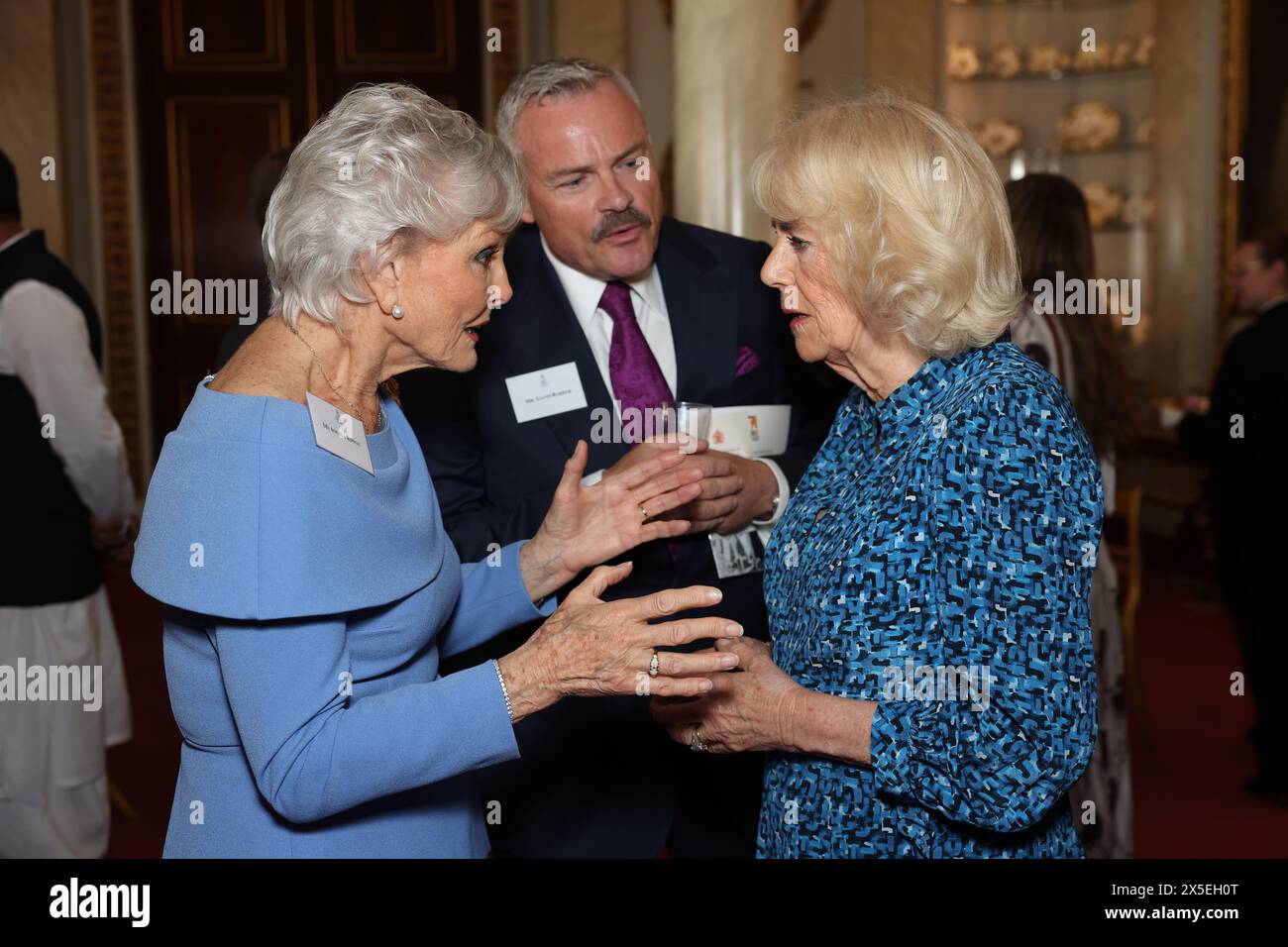 Queen Camilla speaks to Angela Rippon as she hosts a reception at ...