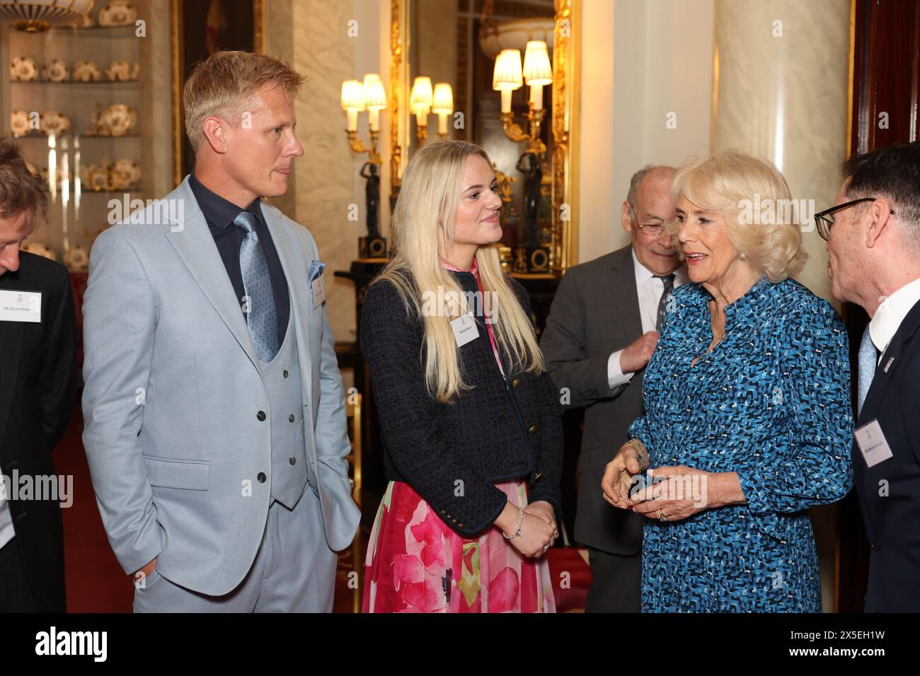Queen Camilla speaks to Esme Higgs and ventaniarian Dr Scott Miller as ...