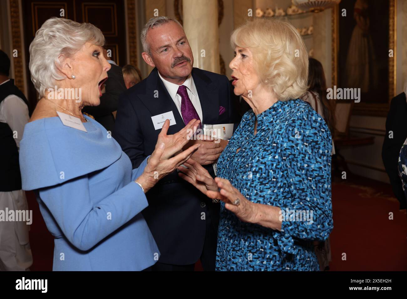 Queen Camilla speaks to Angela Rippon as she hosts a reception at ...