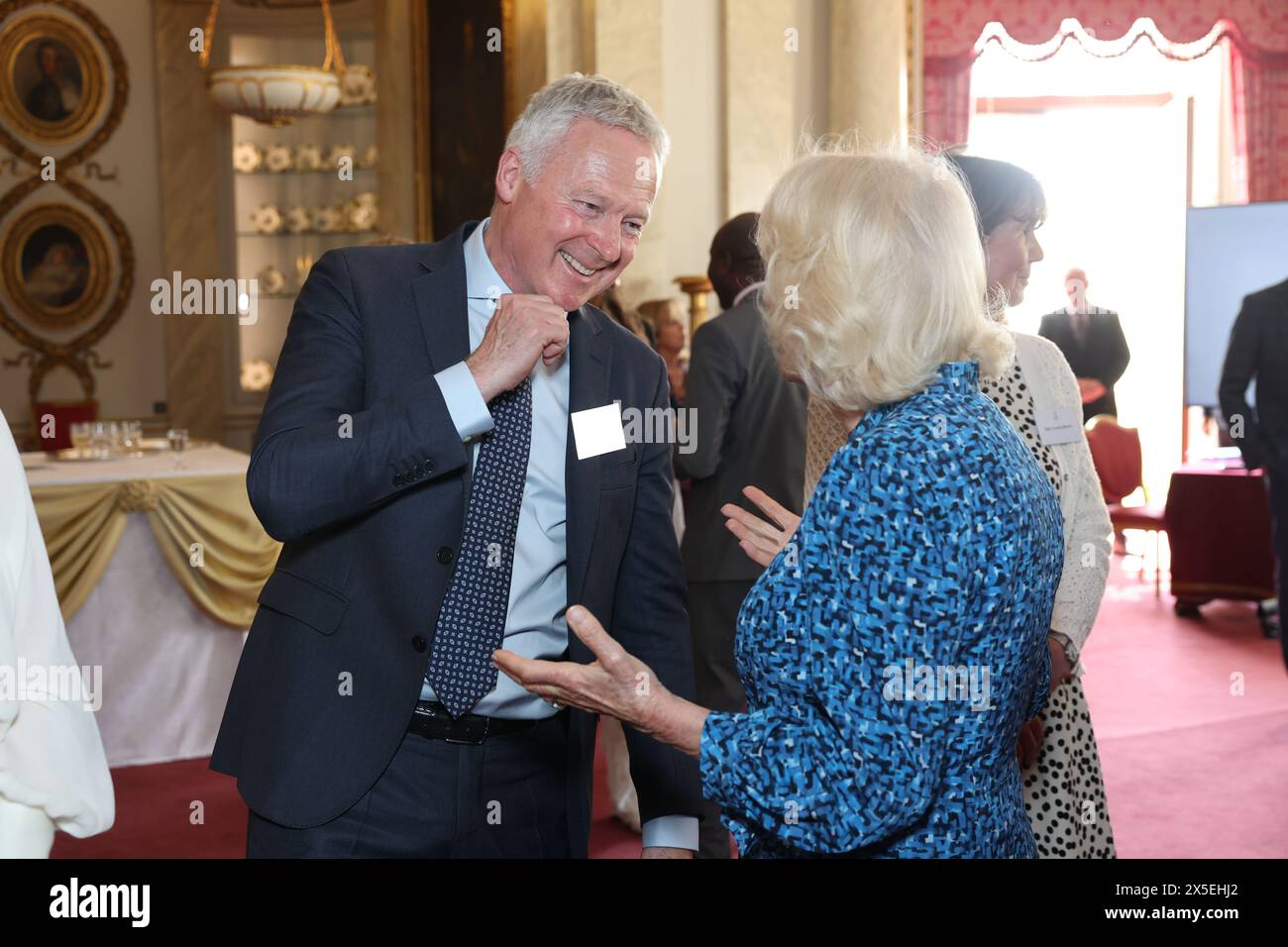 Queen Camilla speaks to Rory Bremner as she hosts a reception at ...