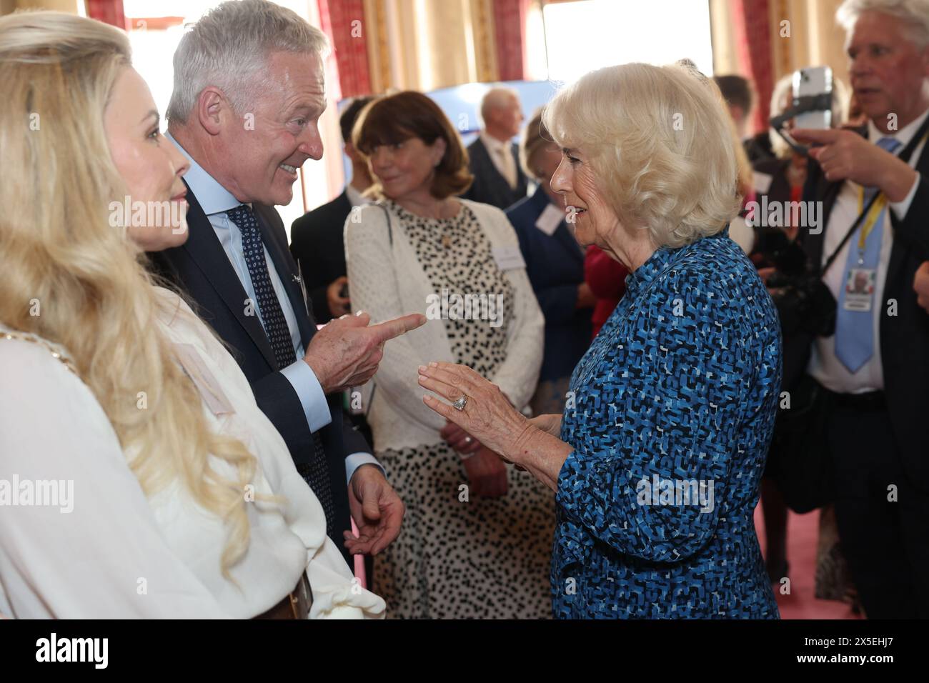 Queen Camilla speaks to Rory Bremner as she hosts a reception at ...