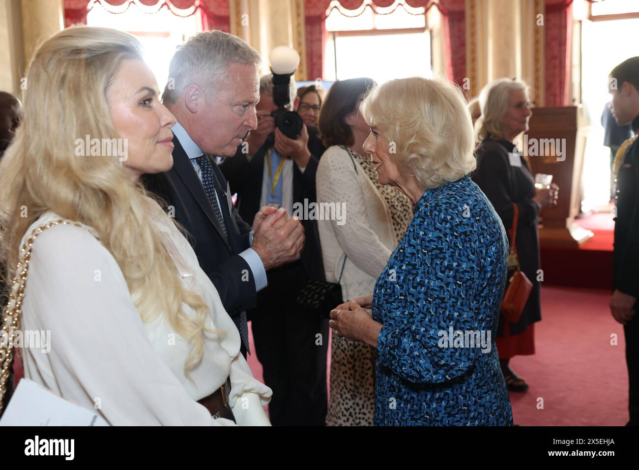 Queen Camilla speaks to Rory Bremner as she hosts a reception at ...