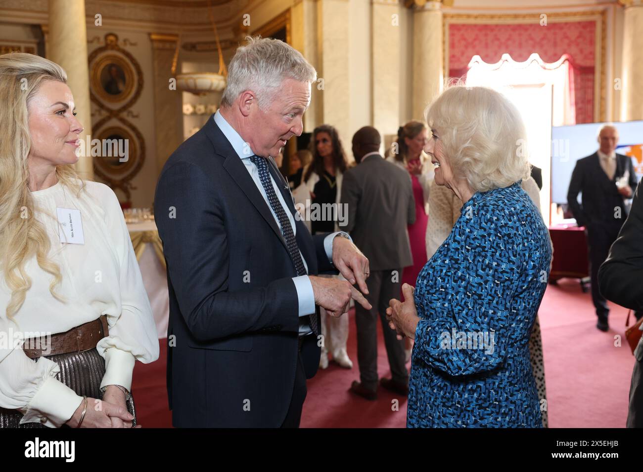 Queen Camilla speaks to Rory Bremner as she hosts a reception at ...
