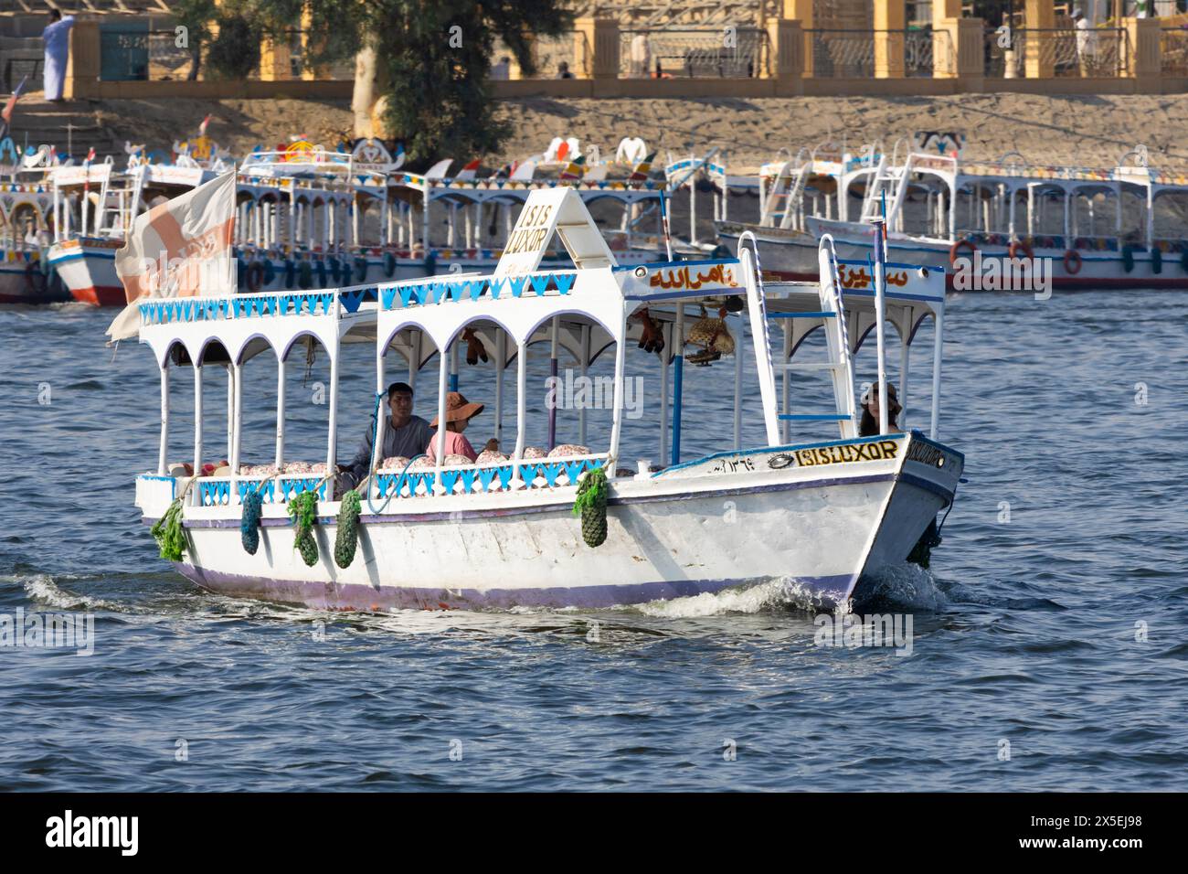 Ferry boats travelling back and forth across the Nile River in Egypt ...