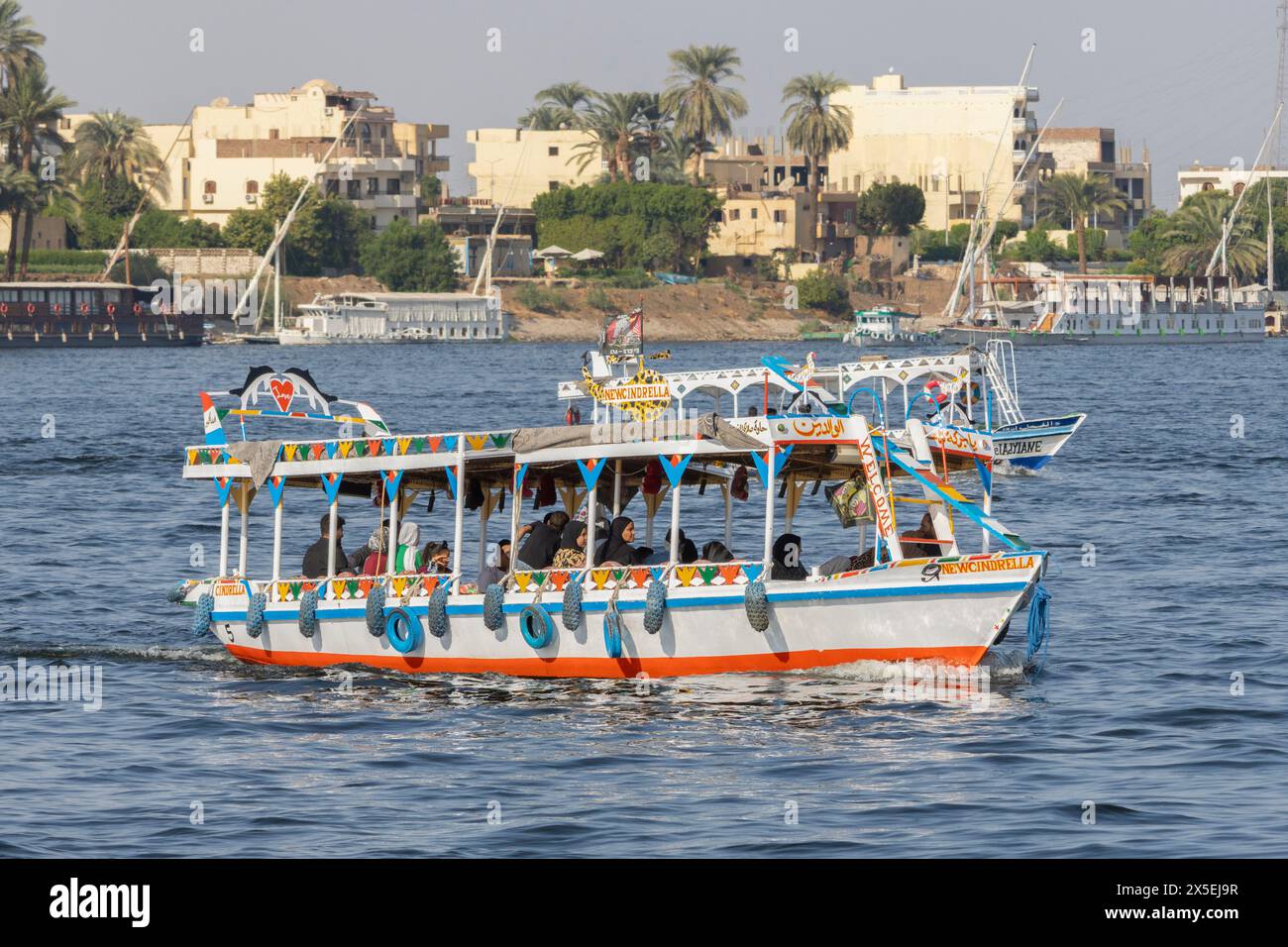 Ferry boats travelling back and forth across the Nile River in Egypt ...