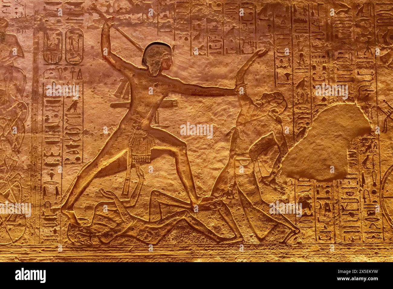 A bas relief carving showing Ramesses II defeating his enemies at the Battle of Kadesh. Inside ...