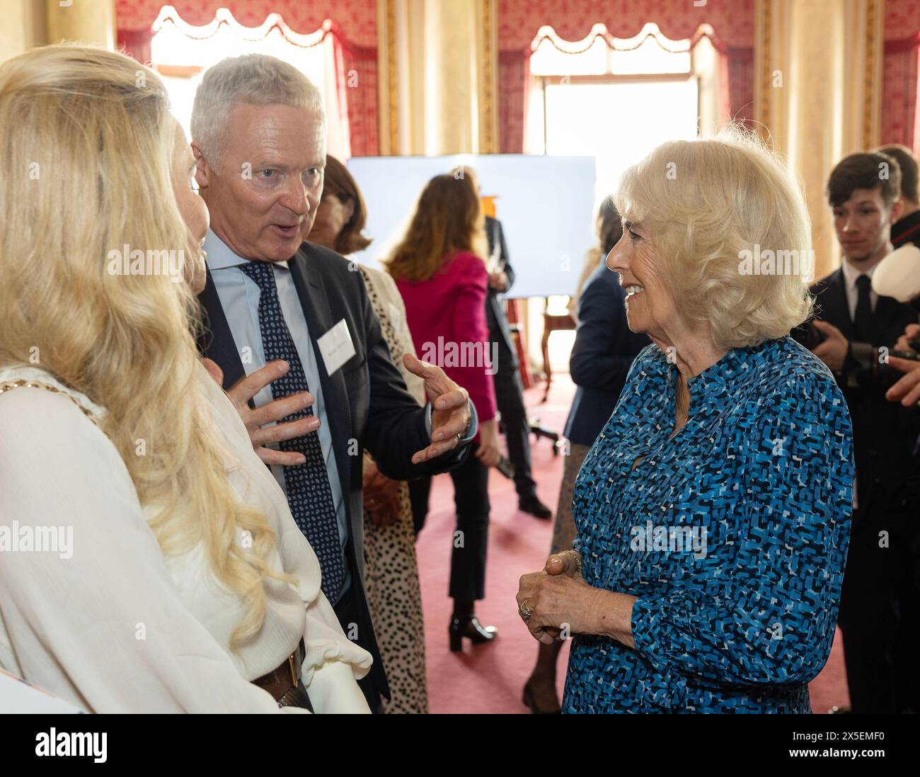 Queen Camilla speaks to Rory Bremner as she hosts a reception at ...