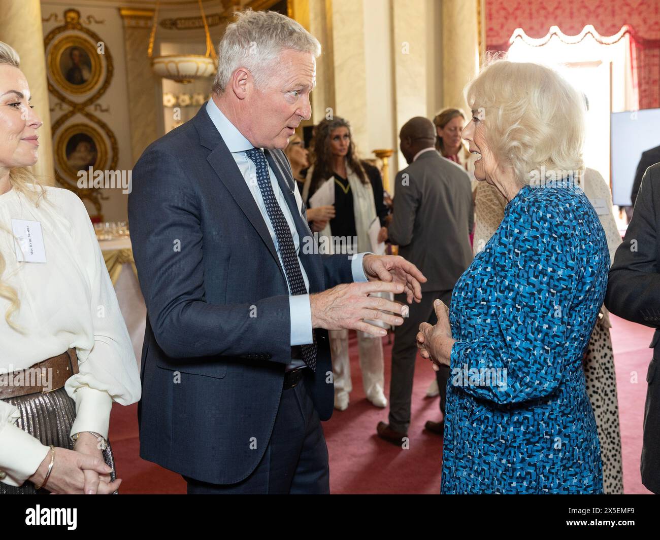 Queen Camilla speaks to Rory Bremner as she hosts a reception at ...