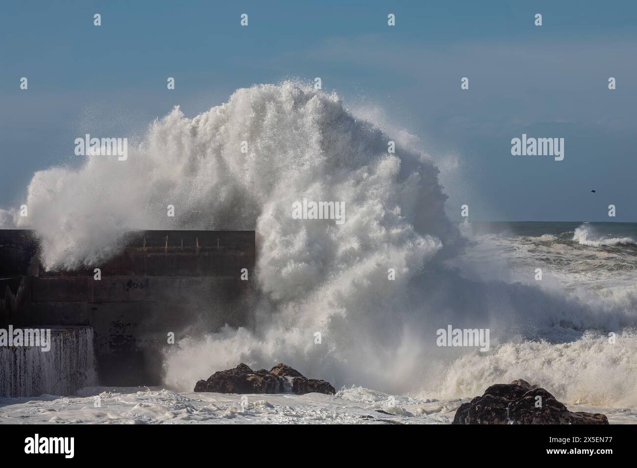 Huge wave splash over a pier from northern portuguese in a stormy but ...