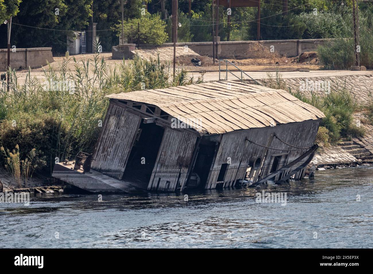 A sign on a dockside building, on the River Nile, for the Edfu Floating ...