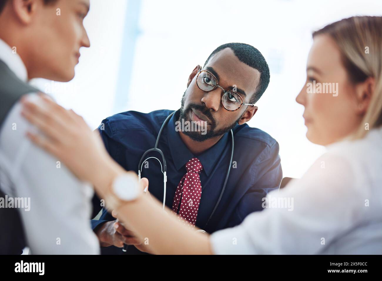 Support, couple and doctor with consultation for diagnosis with ...