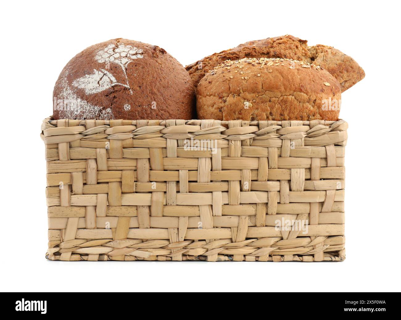 Basket with different types of fresh bread isolated on white Stock ...