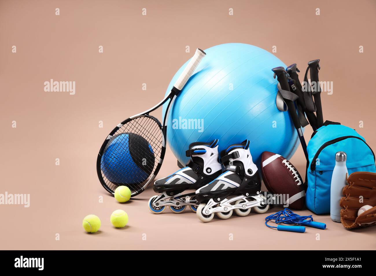 Many different sports equipment on beige background Stock Photo - Alamy