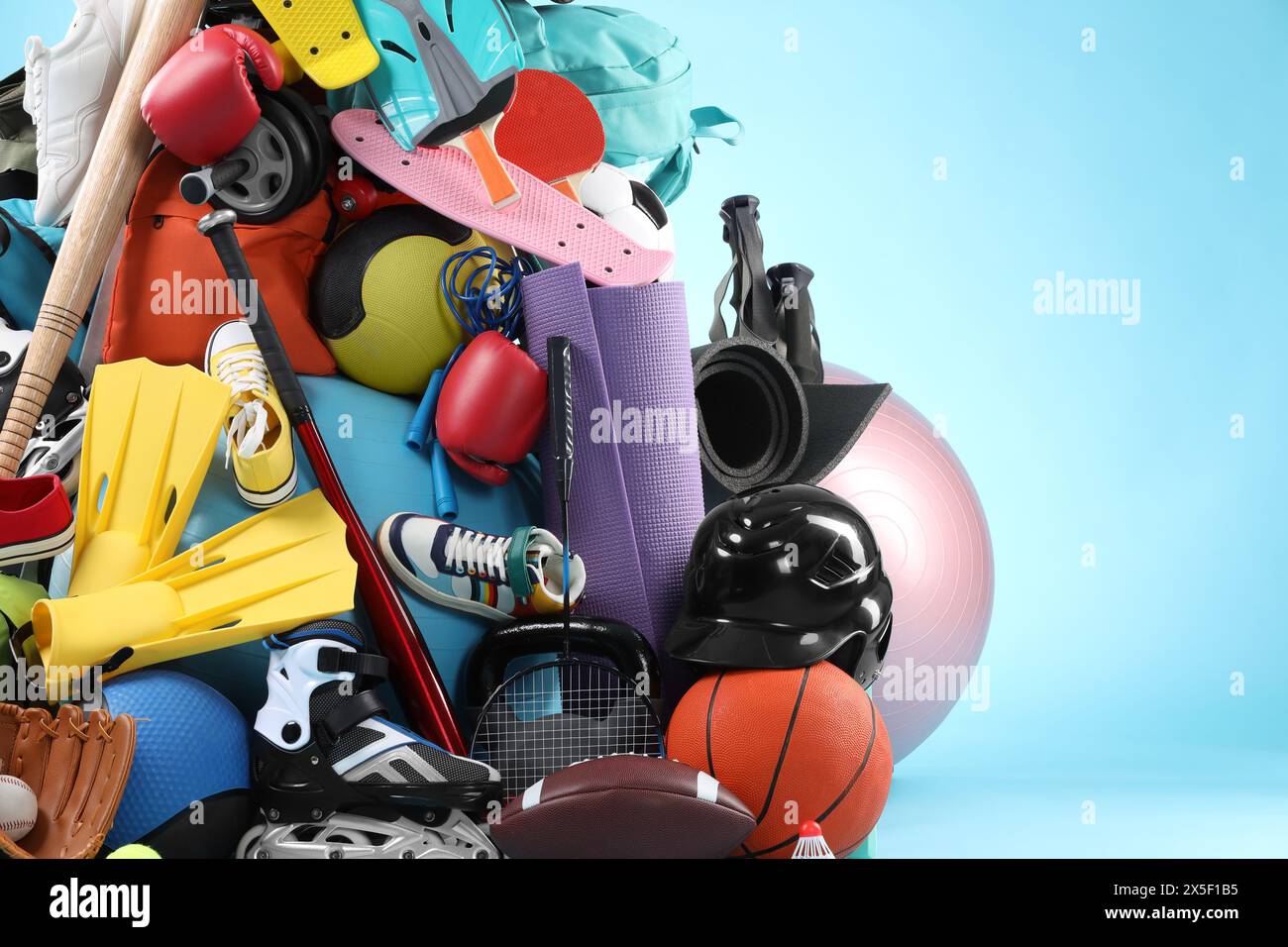 Many different sports equipment on light blue background Stock Photo ...