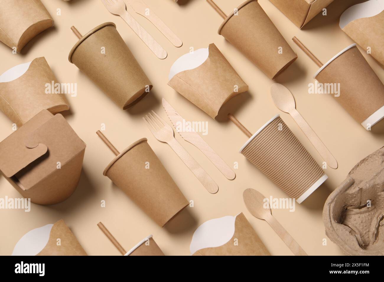 Eco friendly food packaging. Paper containers and wooden cutlery on ...