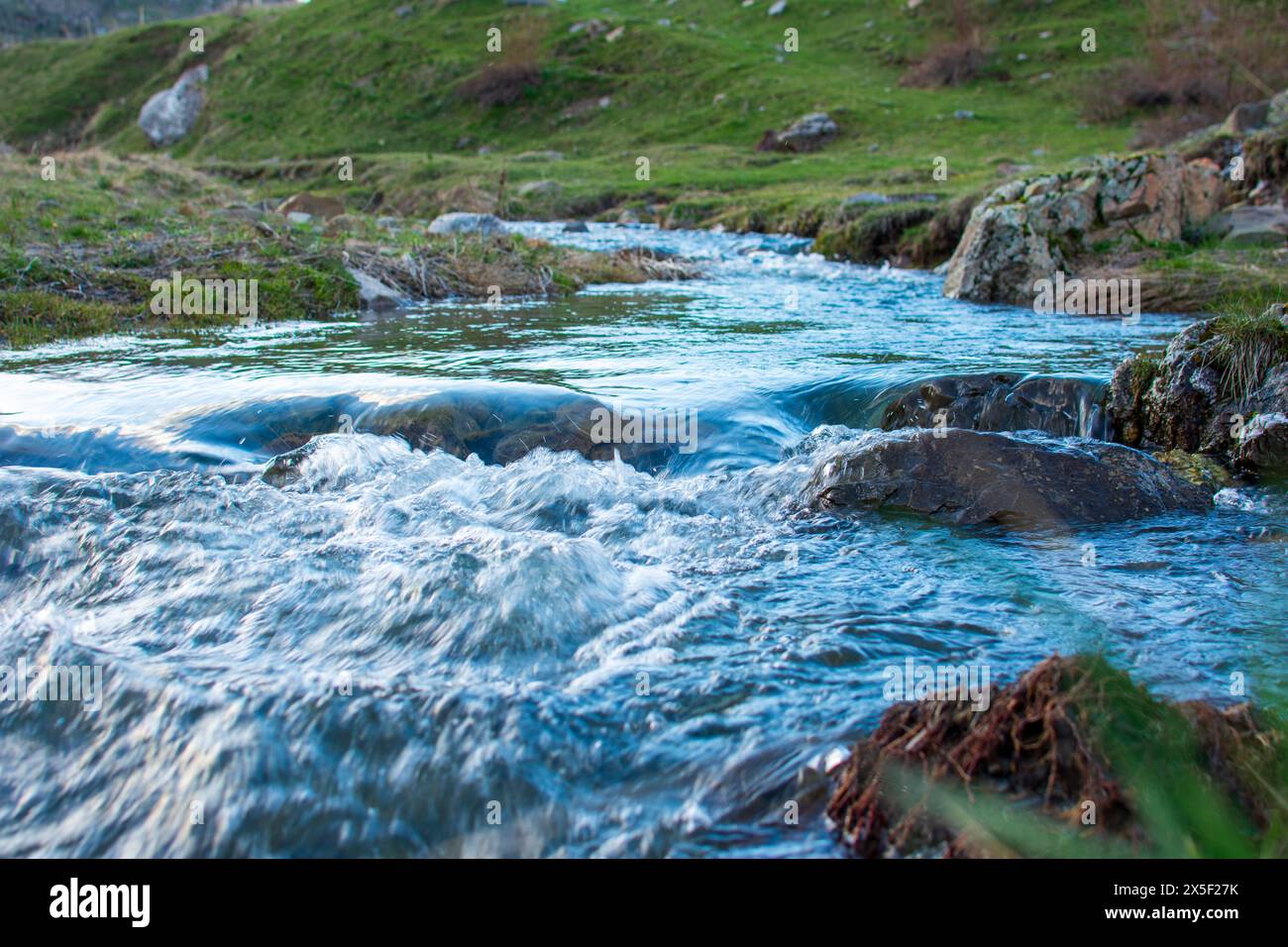 river formed by the thawing of the mountain peaks Stock Photo - Alamy