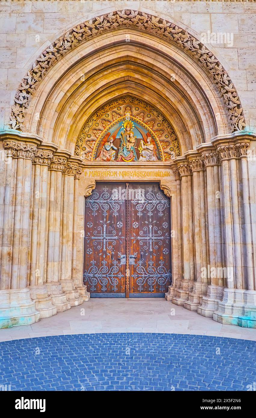 The carved stone front gate of Matthias Church, decorated with wall ...