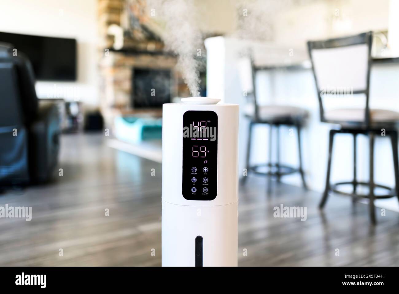 A humidifier at work inside a modern home, with digital readout display ...