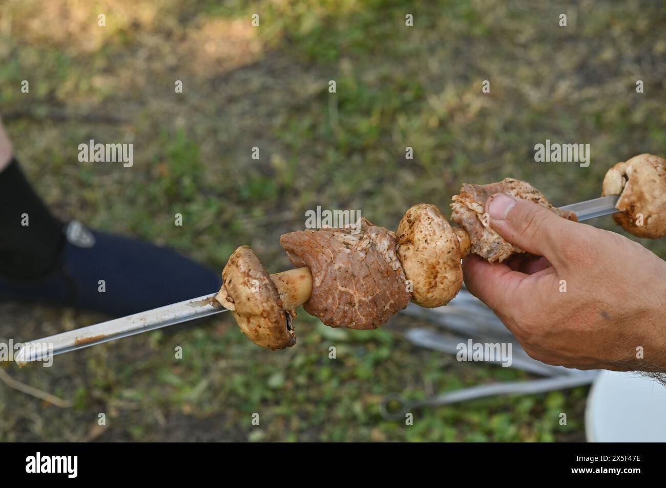 Skewering meat hi-res stock photography and images - Alamy