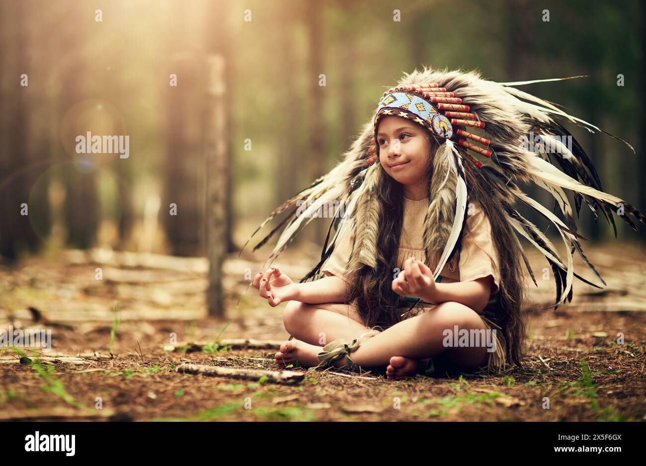 Nature, forest and child in Native American costume for meditation ...