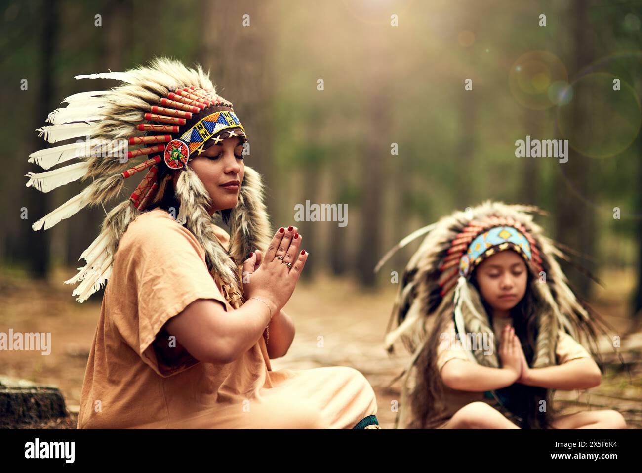 Native American chief, woman and outdoor for meditation with child for ...