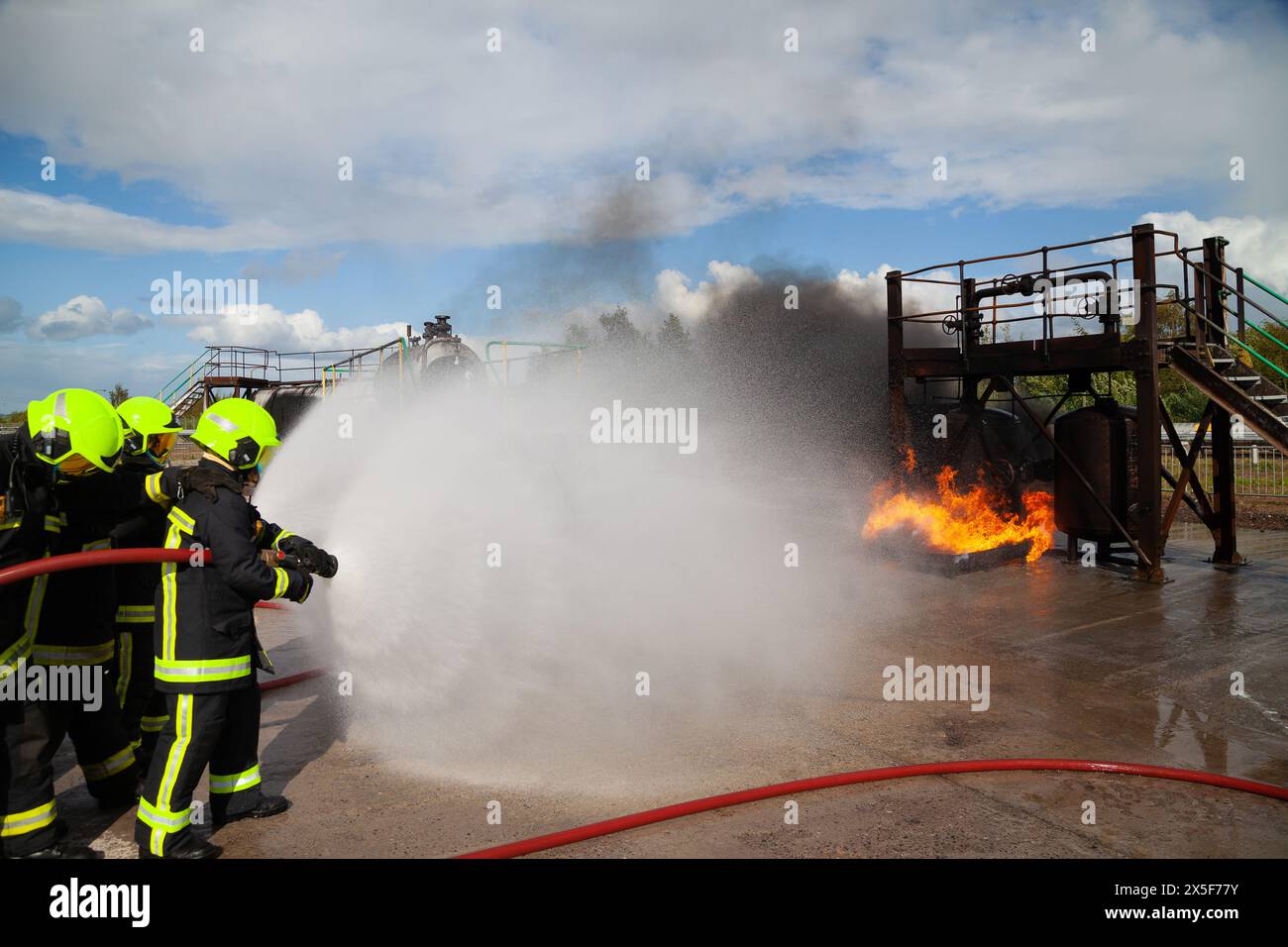 Firemen training, spraying water at fire at ineos oil refinery ...