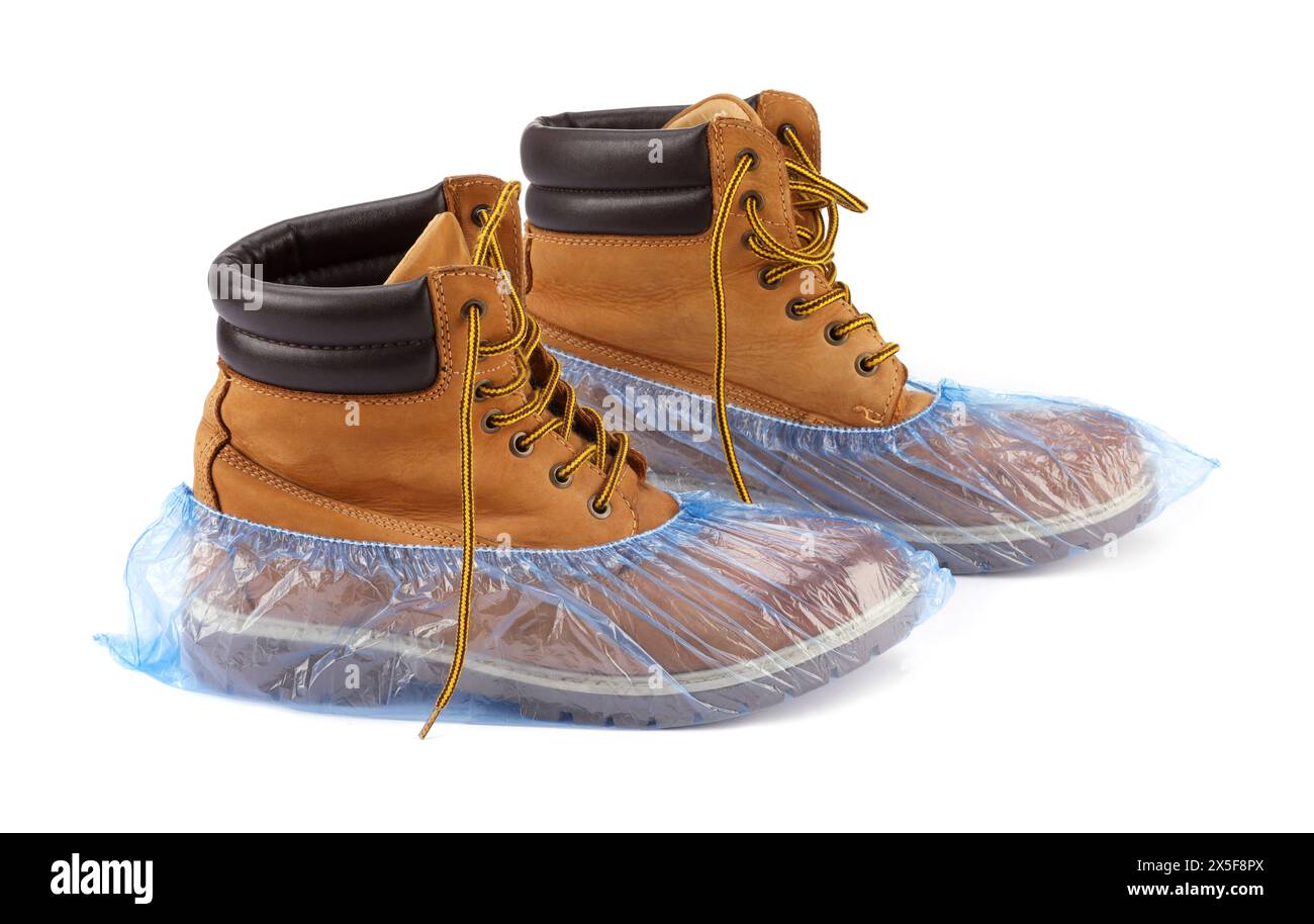 Boots in blue shoe covers isolated on white Stock Photo - Alamy