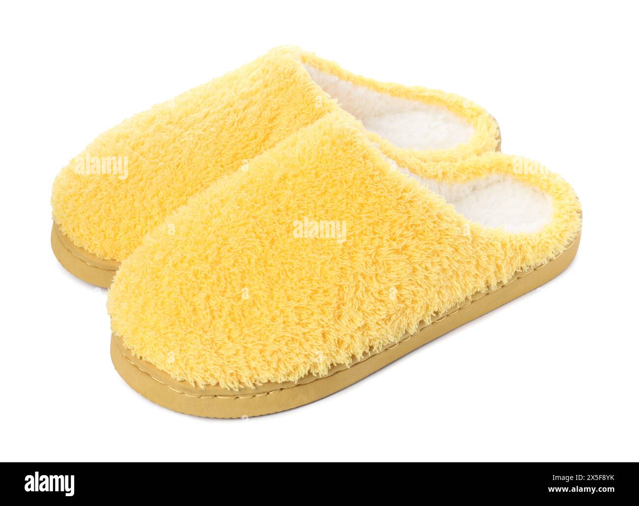 Pair of yellow soft slippers isolated on white Stock Photo - Alamy