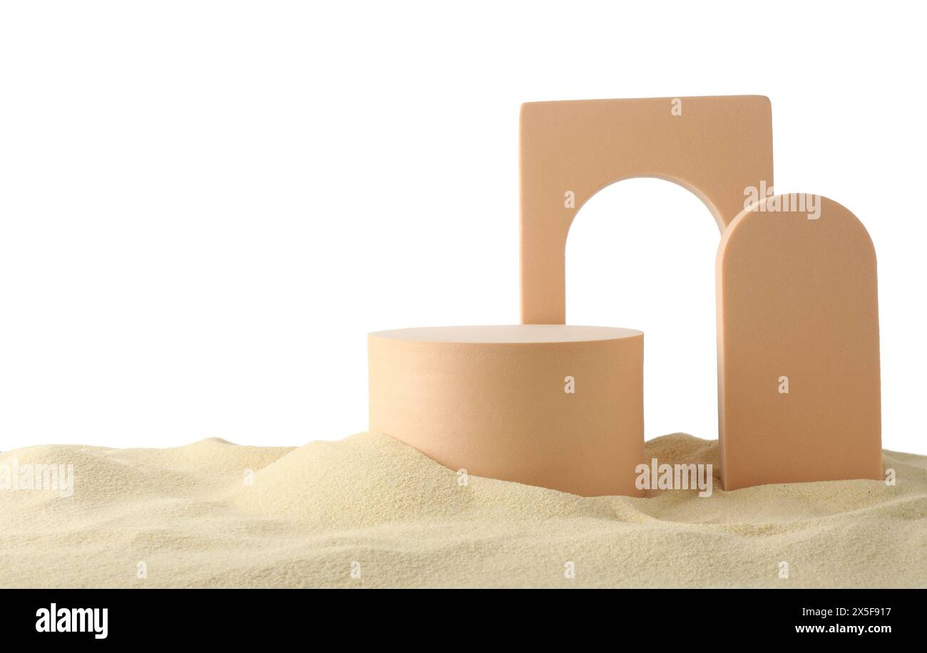 Presentation of product. Different podiums on sand against white ...