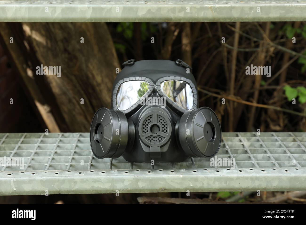 One gas mask on stairs outdoors. Safety equipment Stock Photo - Alamy
