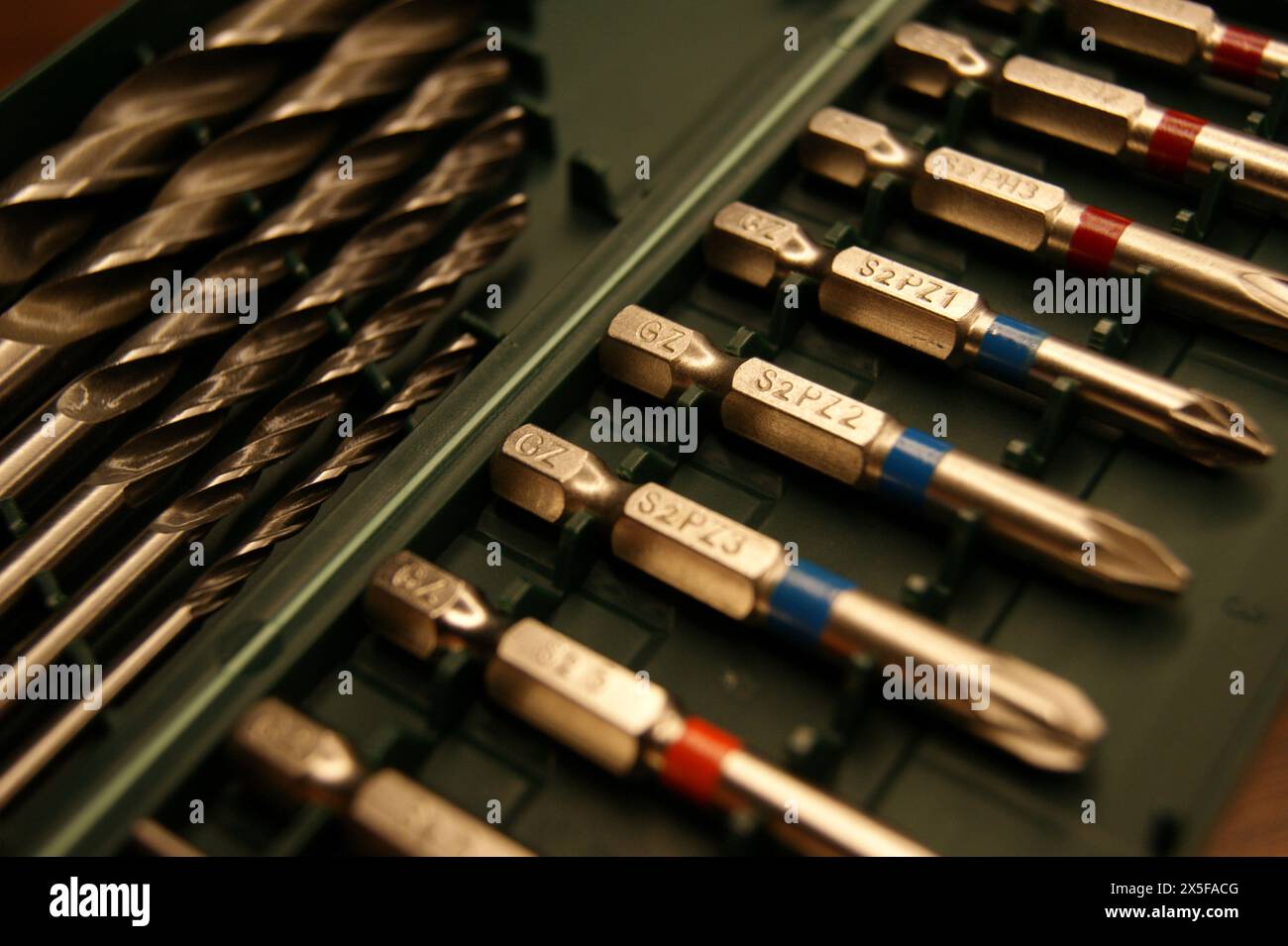 New drill set, new bit set, close-up Stock Photo - Alamy